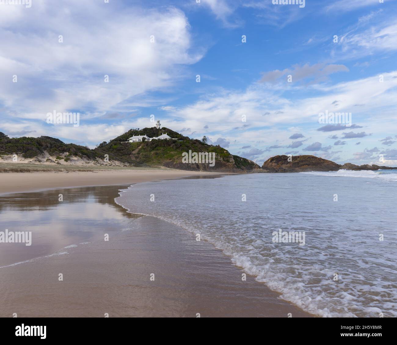 late afternoon view of sugarloaf point lighthouse from the beach at ...
