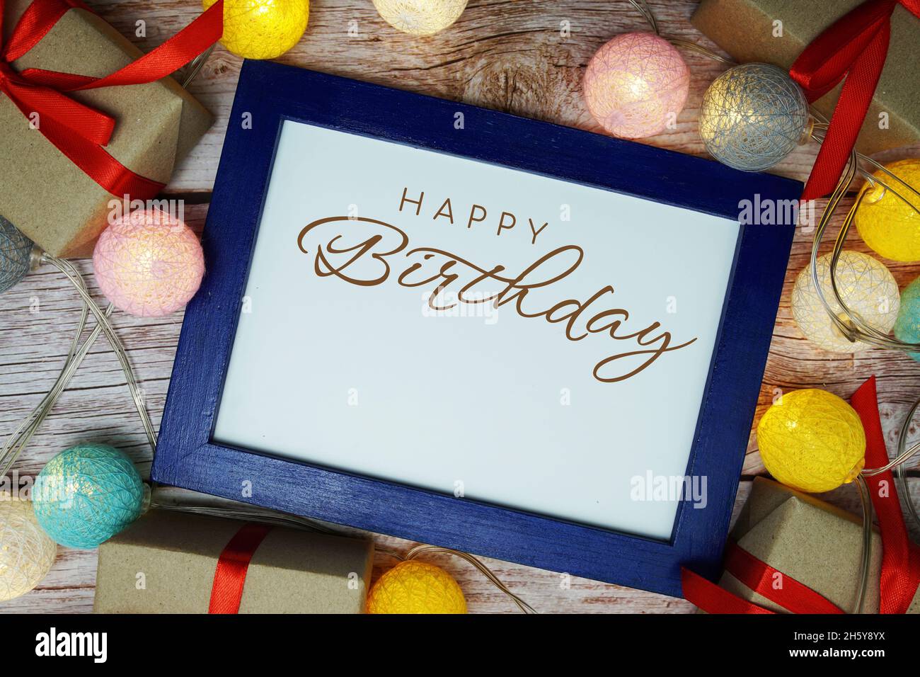 Happy Birthday card typography text with LED cotton ball on wooden ...