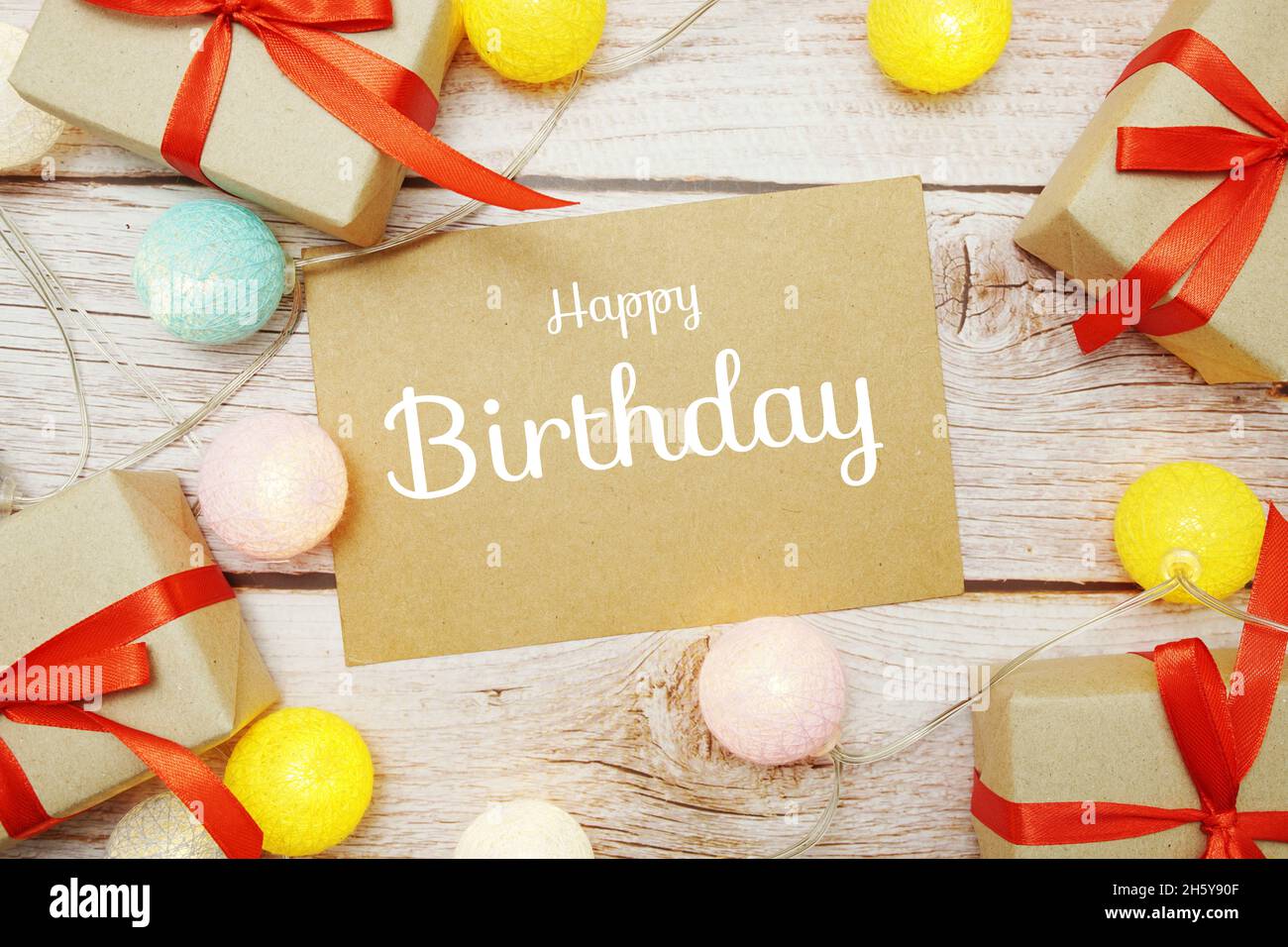 Happy Birthday card typography text with LED cotton ball on wooden ...