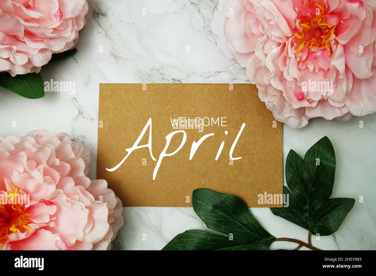 Welcome April typography text with peony flowers on marble background ...