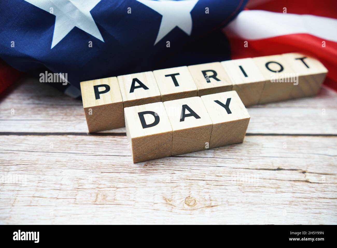 Patriot Day alphabet letter and American flag on wooden background ...