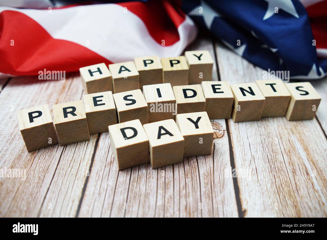 Happy Presidents Day alphabet letter and American flag on wooden ...