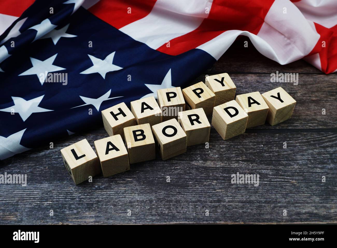 Happy Labor Day Word alphabet letters with USA flag on wooden ...