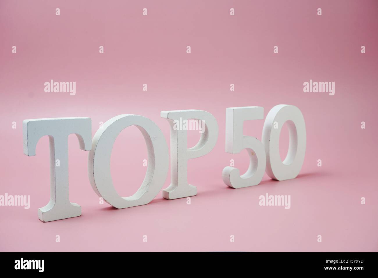 Top 50 word alphabet letters on pink background Stock Photo - Alamy
