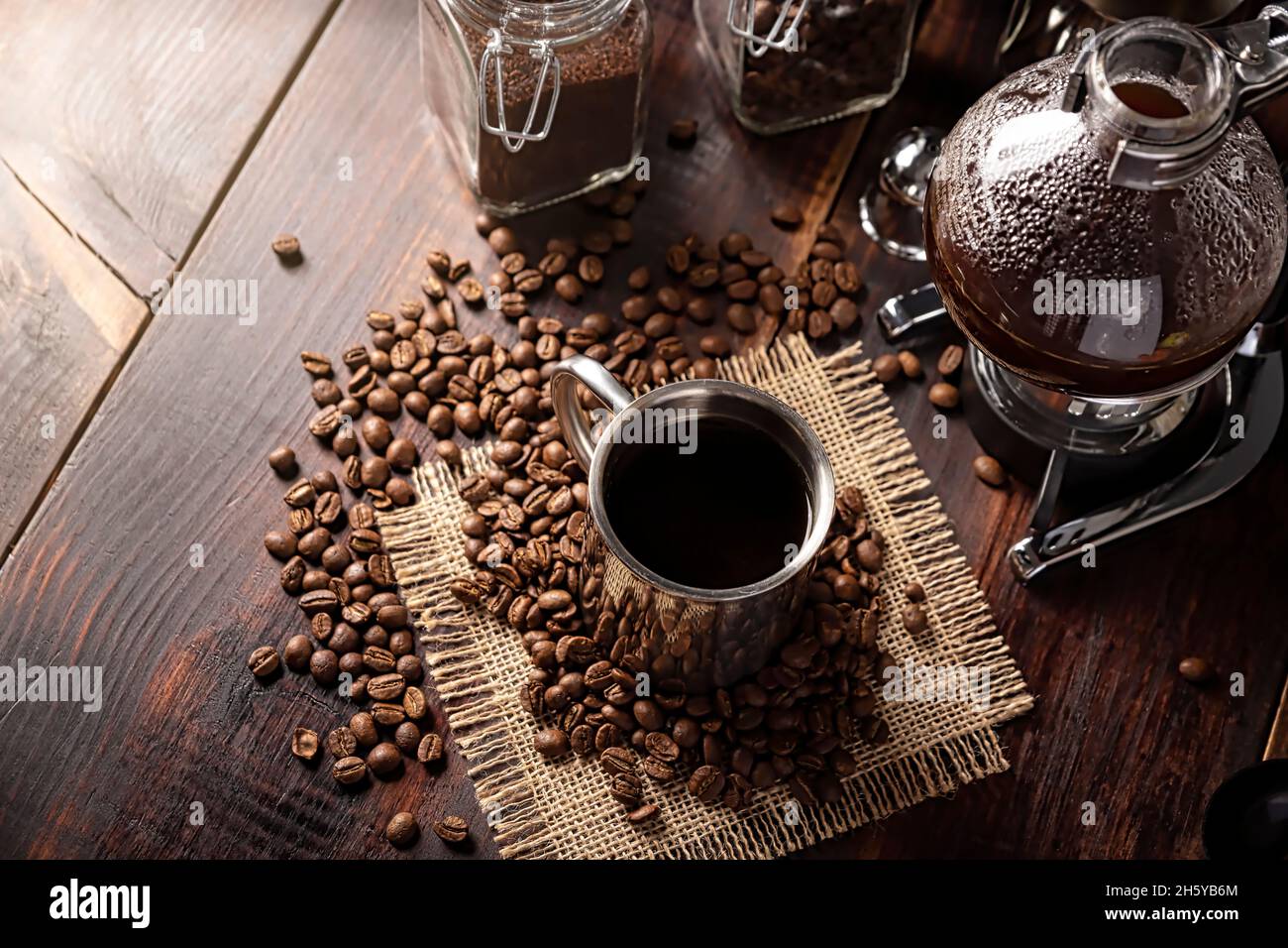 Metallic cup and vacuum coffee maker also known as vac pot, siphon or ...