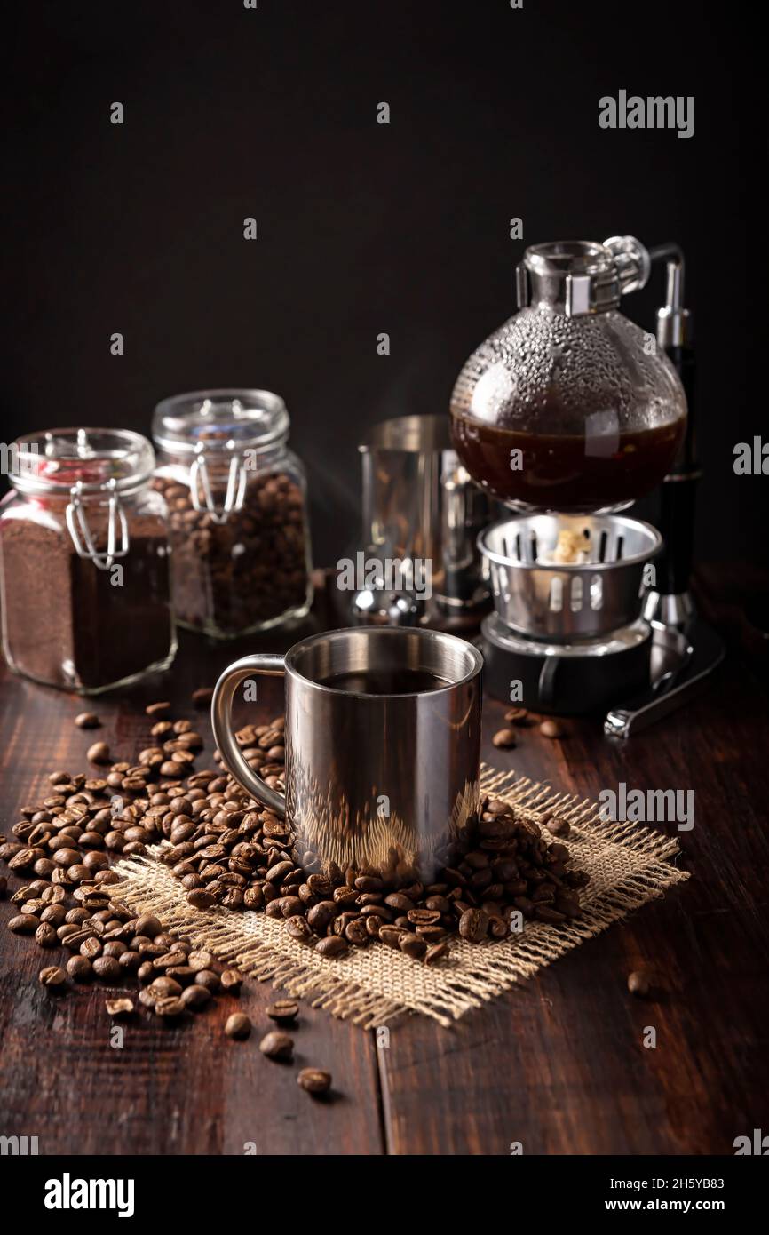 Metallic cup and vacuum coffee maker also known as vac pot, siphon or ...