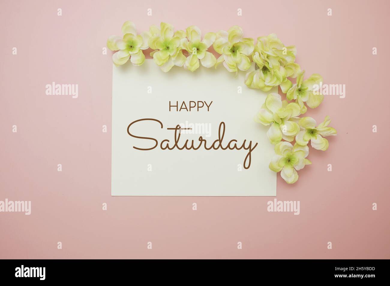 Happy Saturday card typography text with flower bouquet on pink ...