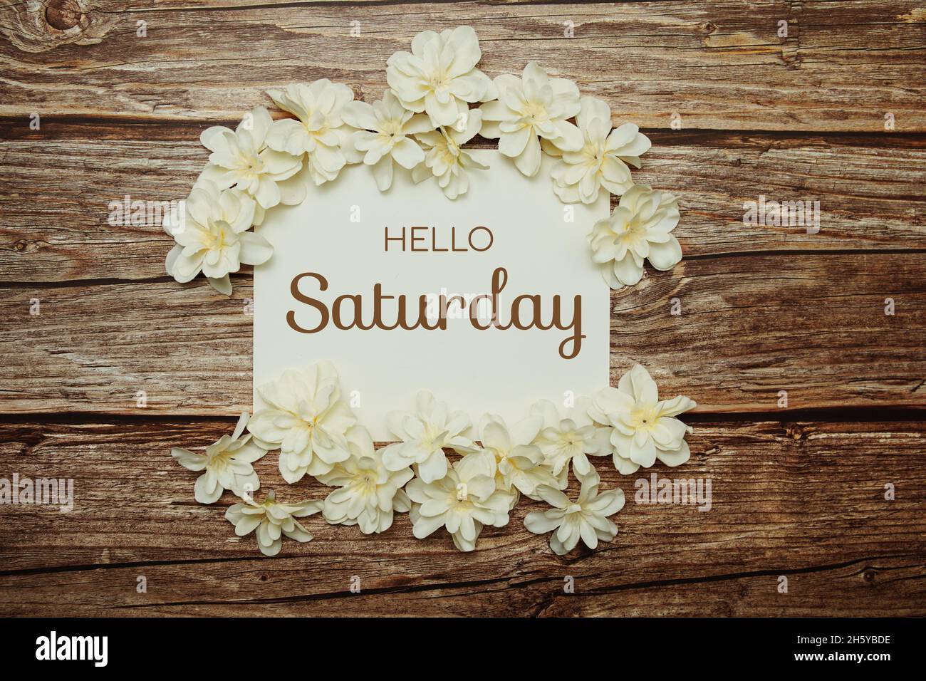 Hello Saturday card typography text with flower bouquet on pink ...