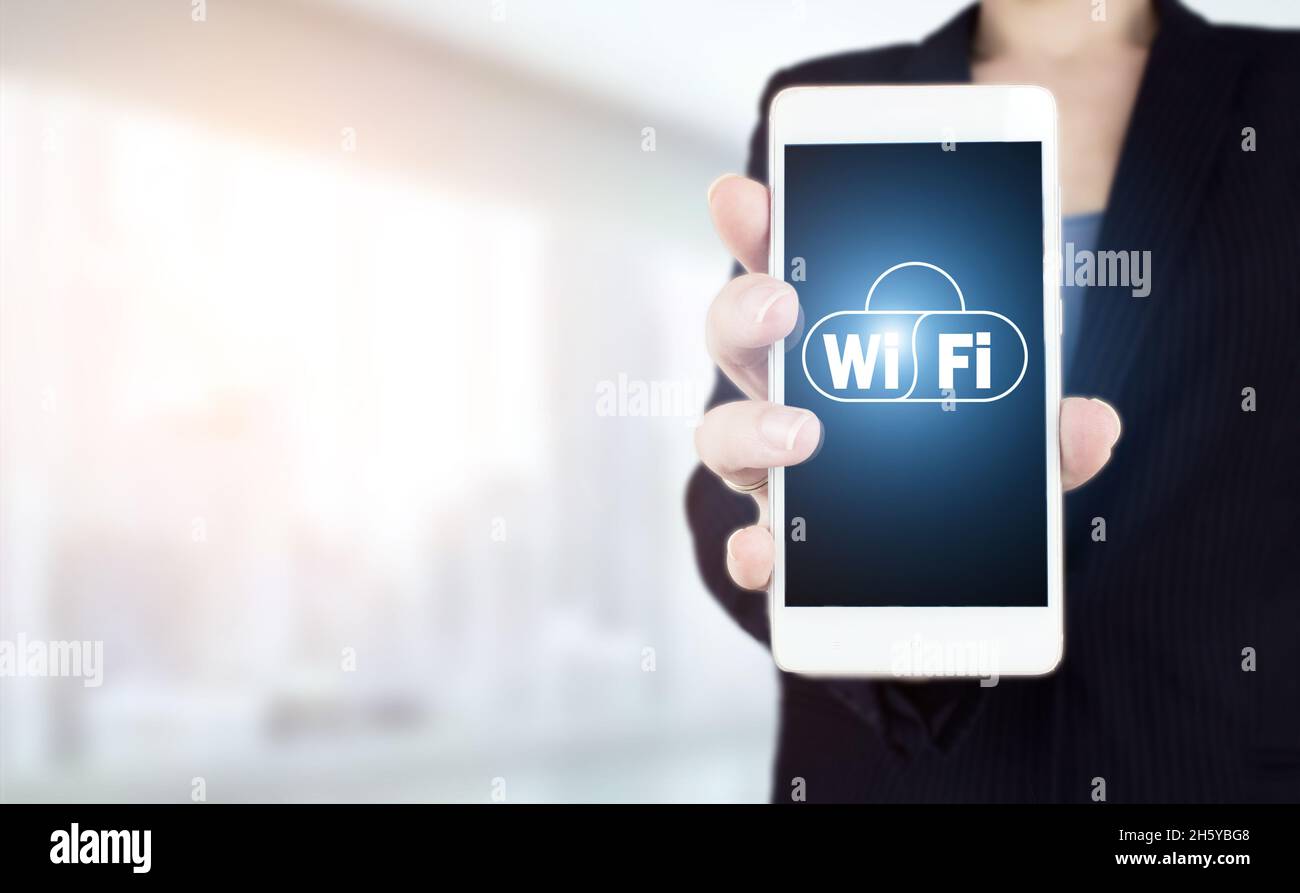 Wi Fi wireless concept. Hand hold white smartphone with digital ...