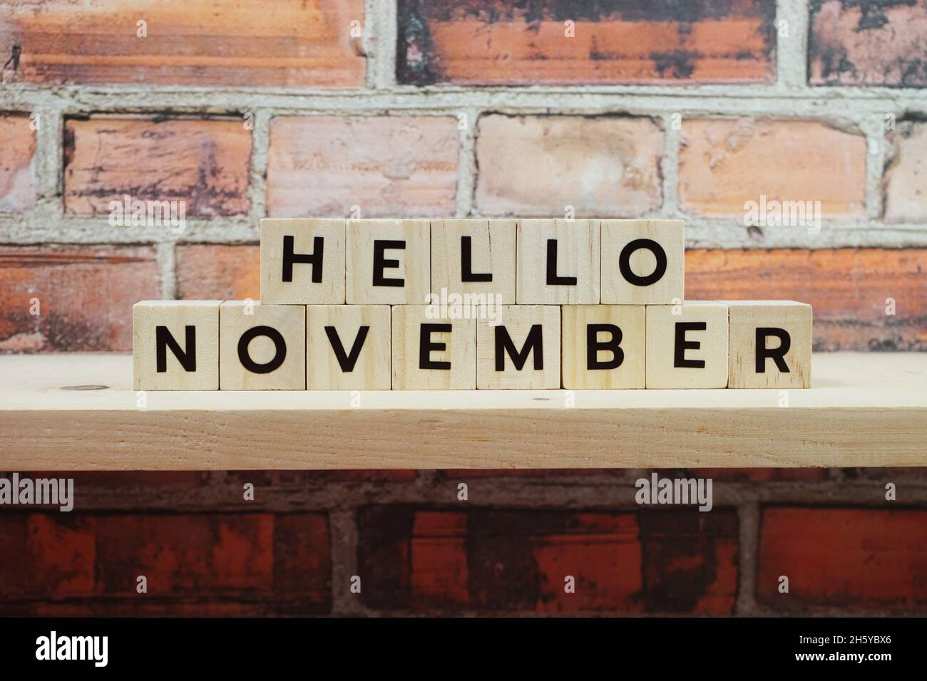Hello November alphabet letter on shelves wooden background Stock Photo ...