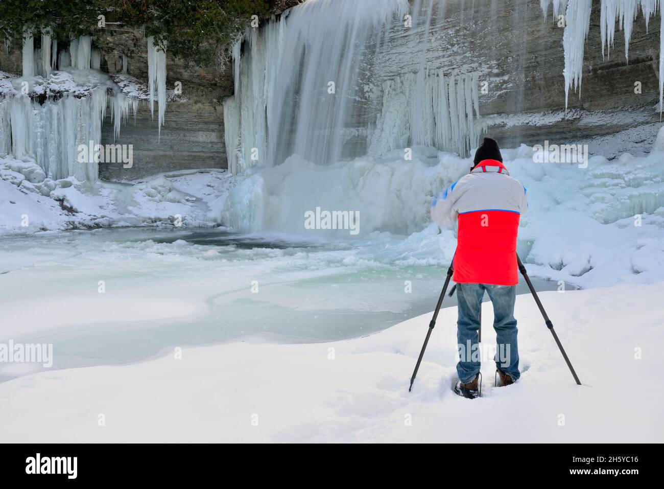 Photographer below Bridal Veil Falls and the Kagawong River in Winter ...