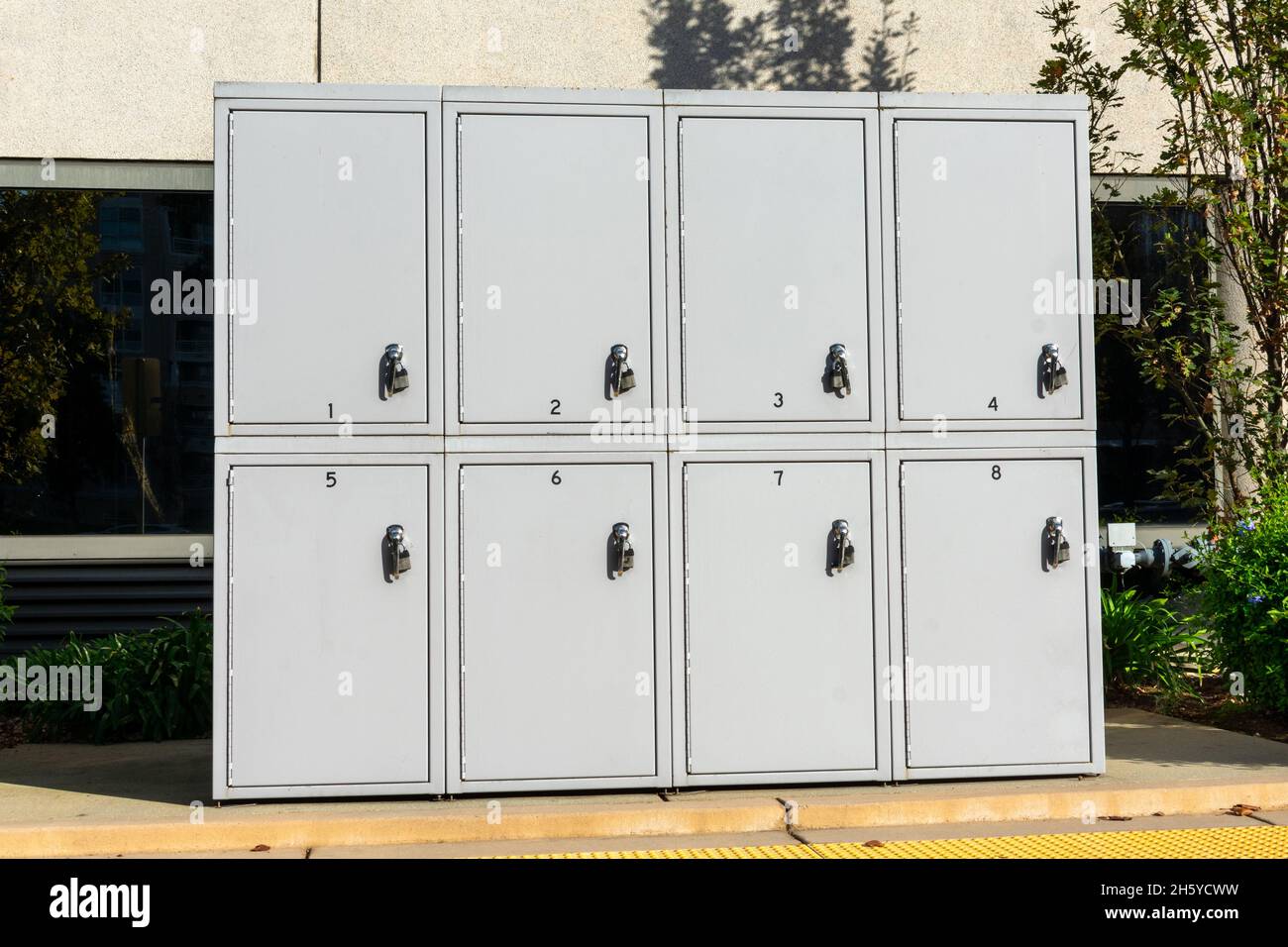 Bike storage lockers securely closed with locks at commercial building ...