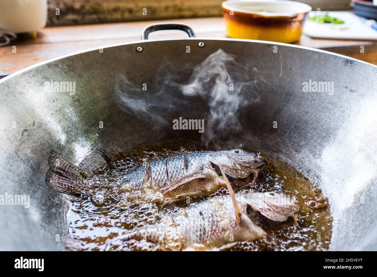 July 2017. Frying fish. Imugan, Nueva Vizcaya, Philippines Stock Photo ...