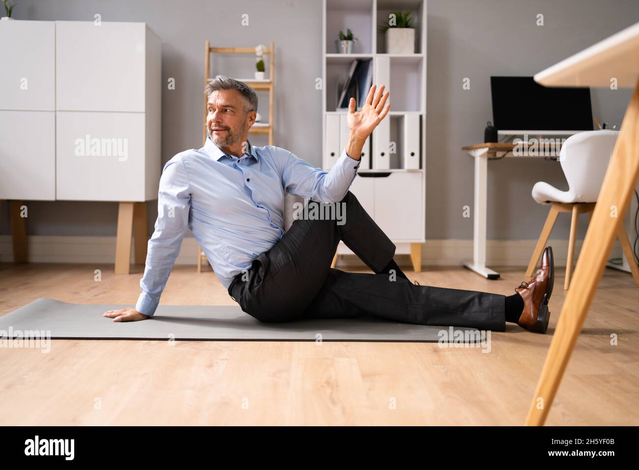 Yoga Stretching Sports Exercise Workout In Office Stock Photo - Alamy