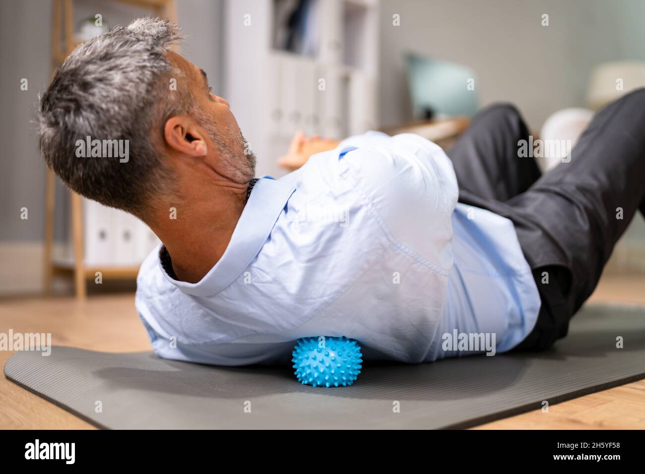 Back Trigger Point Massage Using Spiky Ball Myofascial Release Stock ...