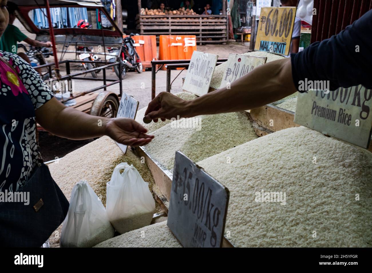 July 2017. A customer receiving change at a local market in Puerto ...