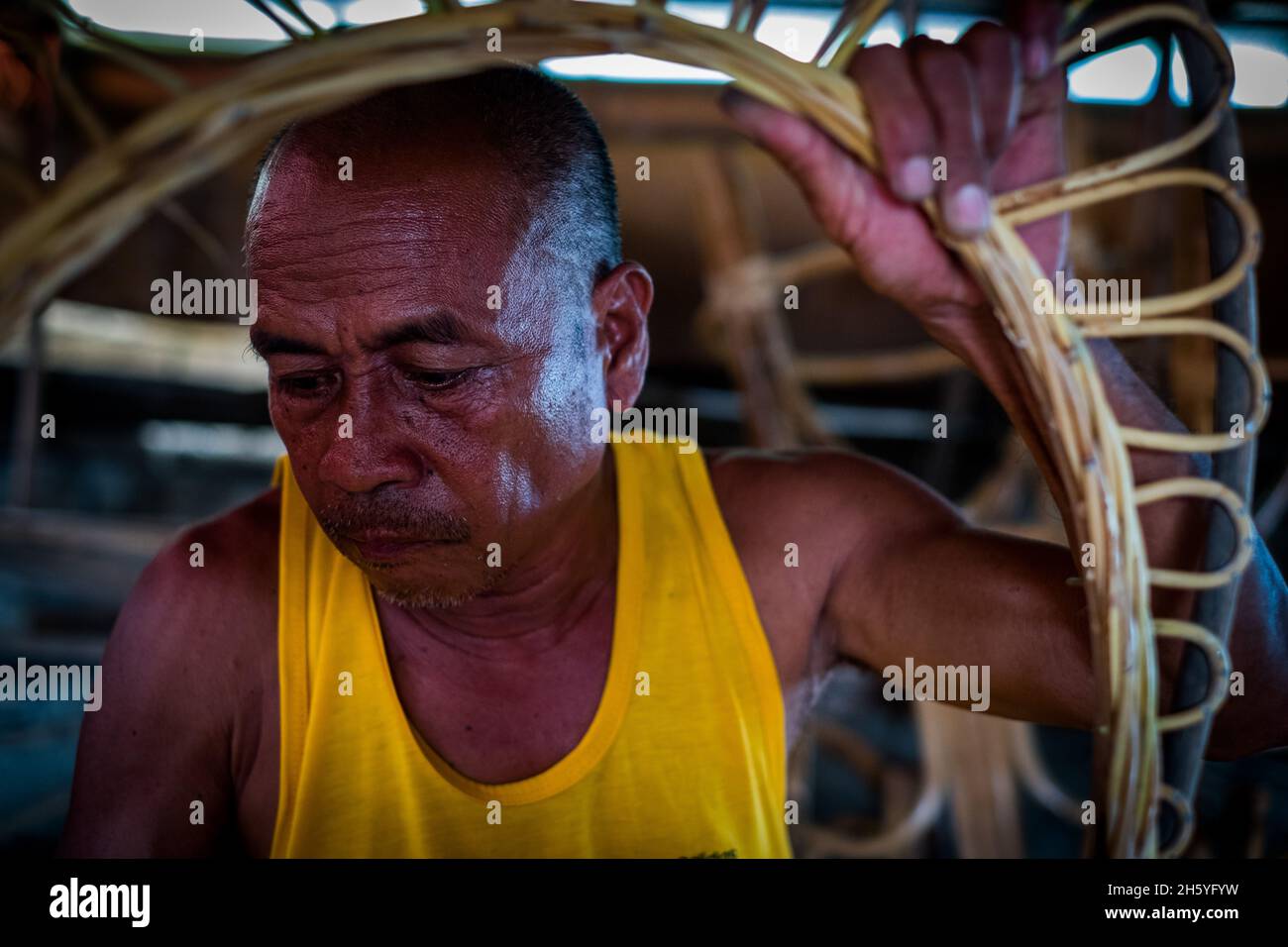 July 2017. Owner, Idevlino Dagot, making rattan furniture at Dagot ...