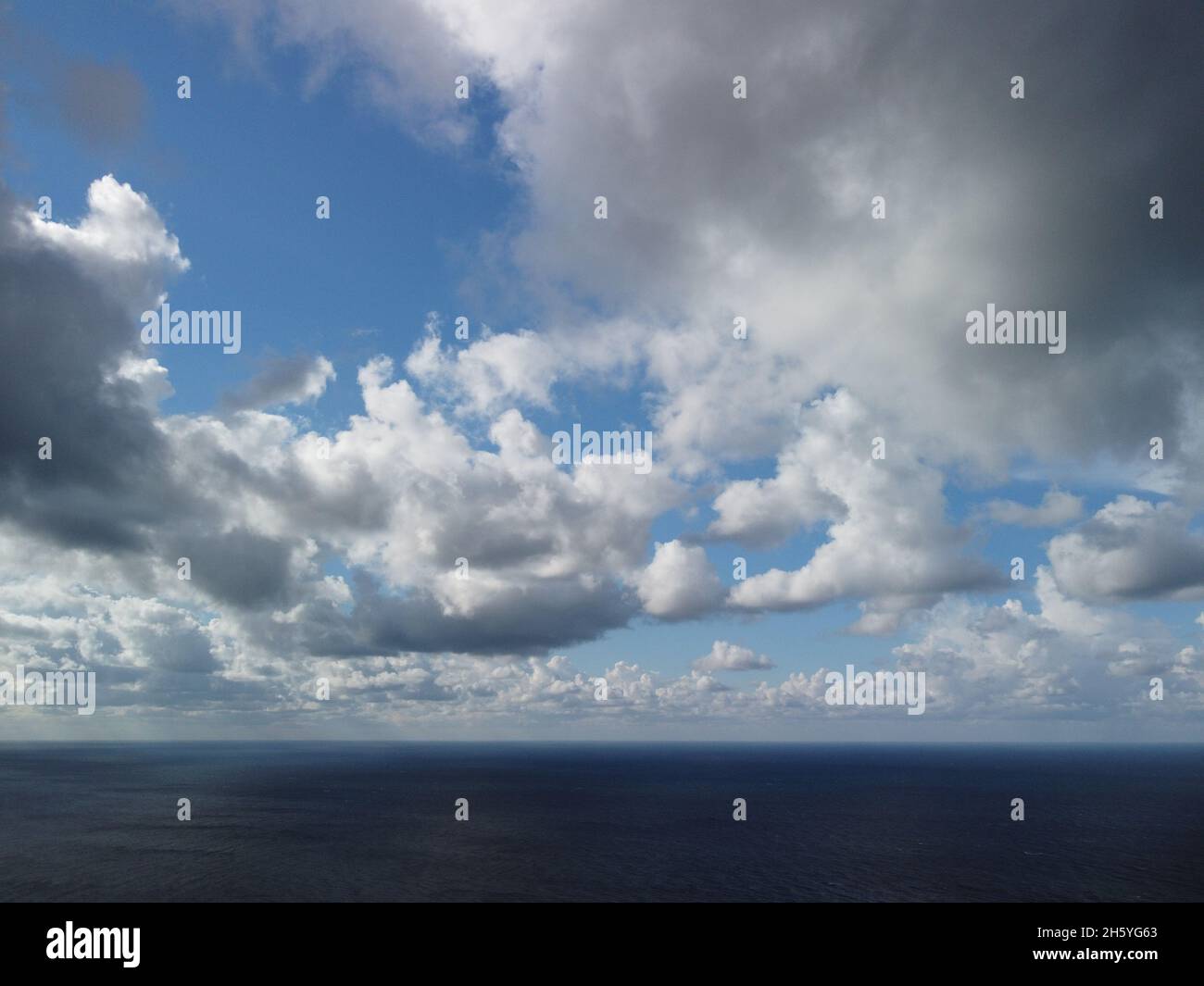 Video fluffy clouds on blue hi-res stock photography and images - Alamy