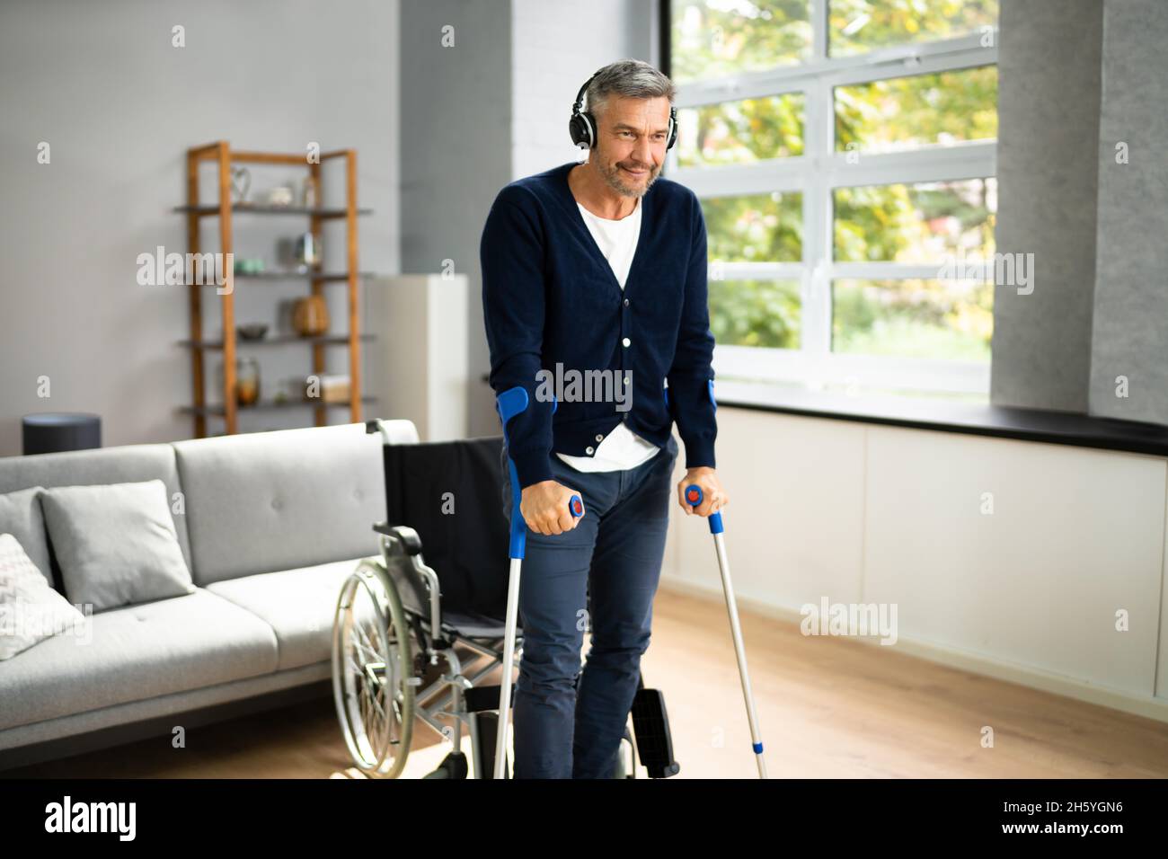Adult Person With Disability Paralysis And Crutches After Injury Stock ...