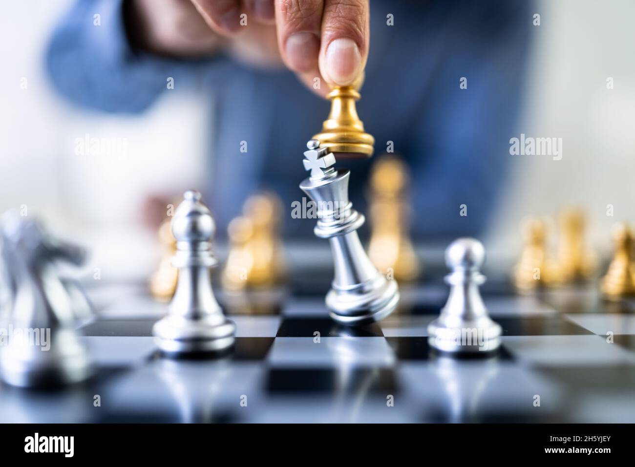 Chess Player Makes A Move To Defeat King Piece Stock Photo - Alamy