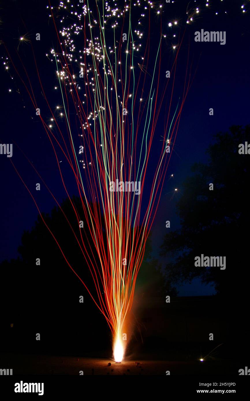 Vertical shot of colorful fireworks on the night sky background Stock ...