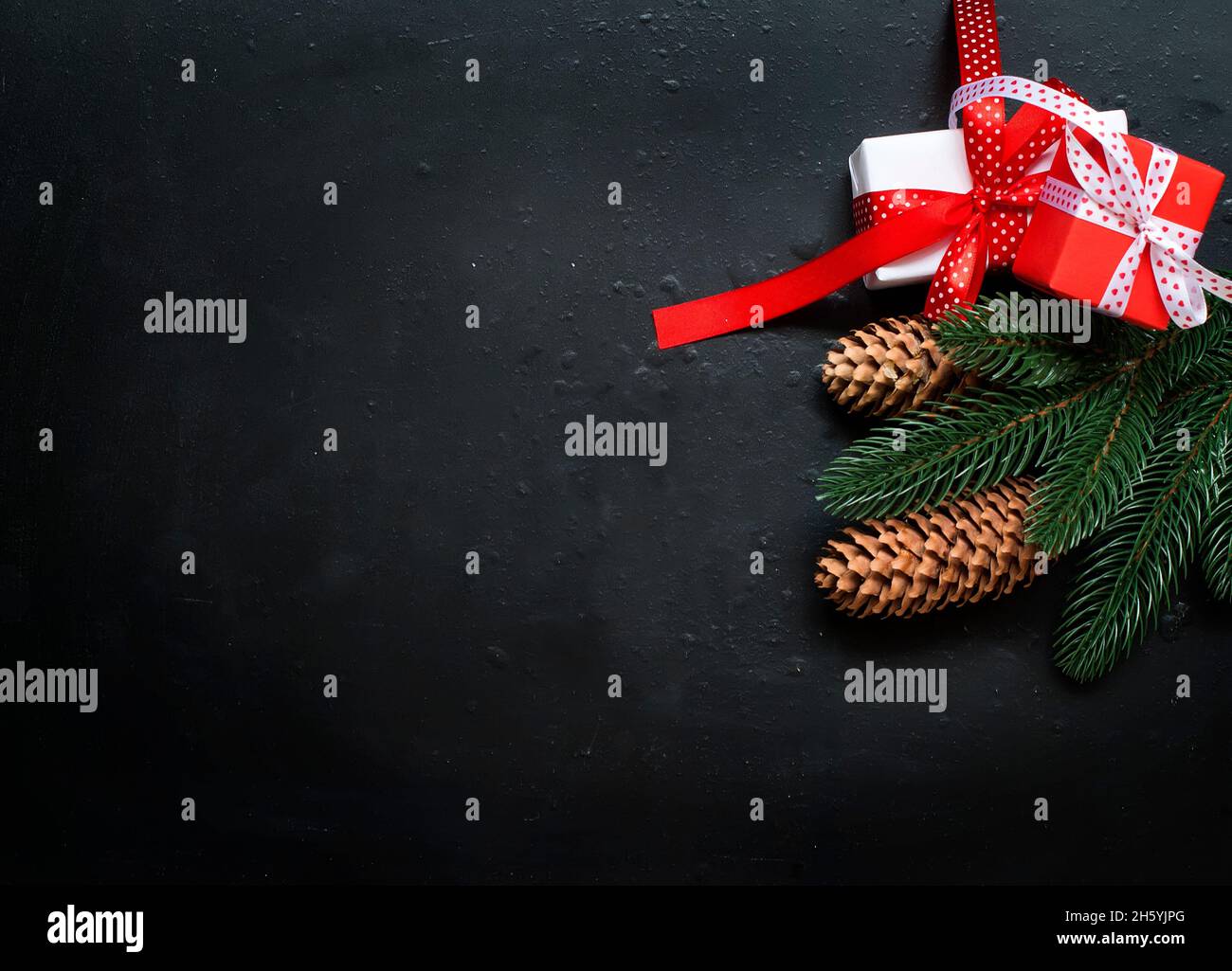 Christmas background. Merry Christmas gifts boxes with tied red ribbon ...