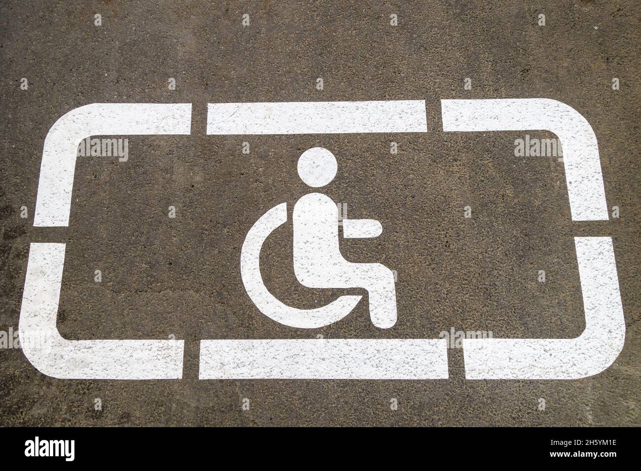 Wheelchair parking symbol on pavement High Resolution Stock Photography ...