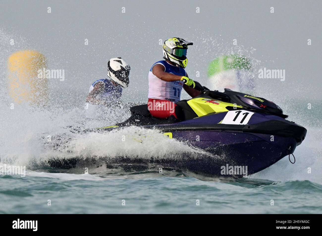 Kuwait City. 11th Nov, 2021. Waleed Al Sharshani (R) of Qatar competes ...