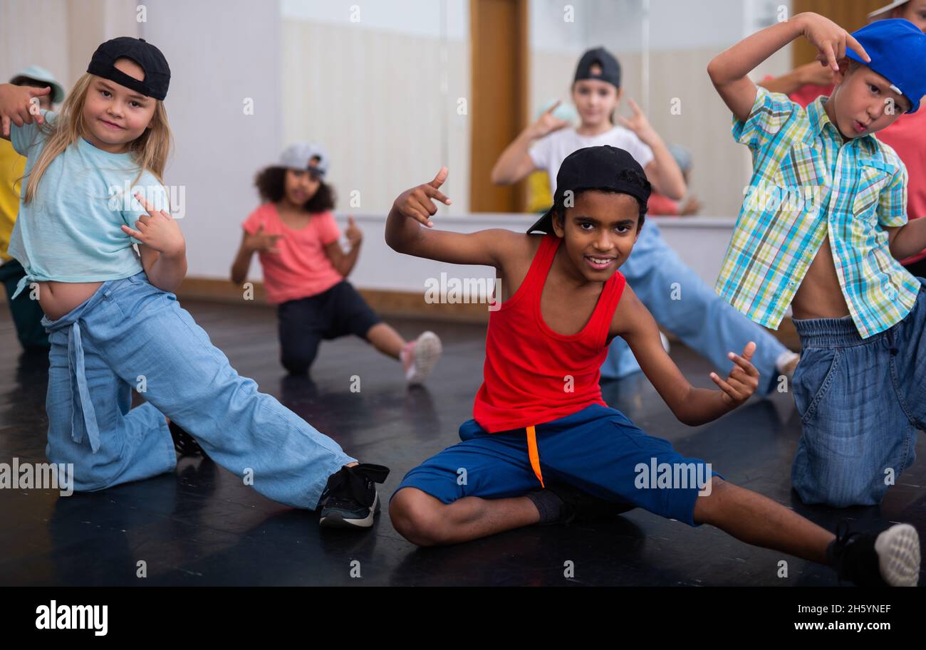 Group of happy tweens practicing hip hop in dance studio Stock Photo ...