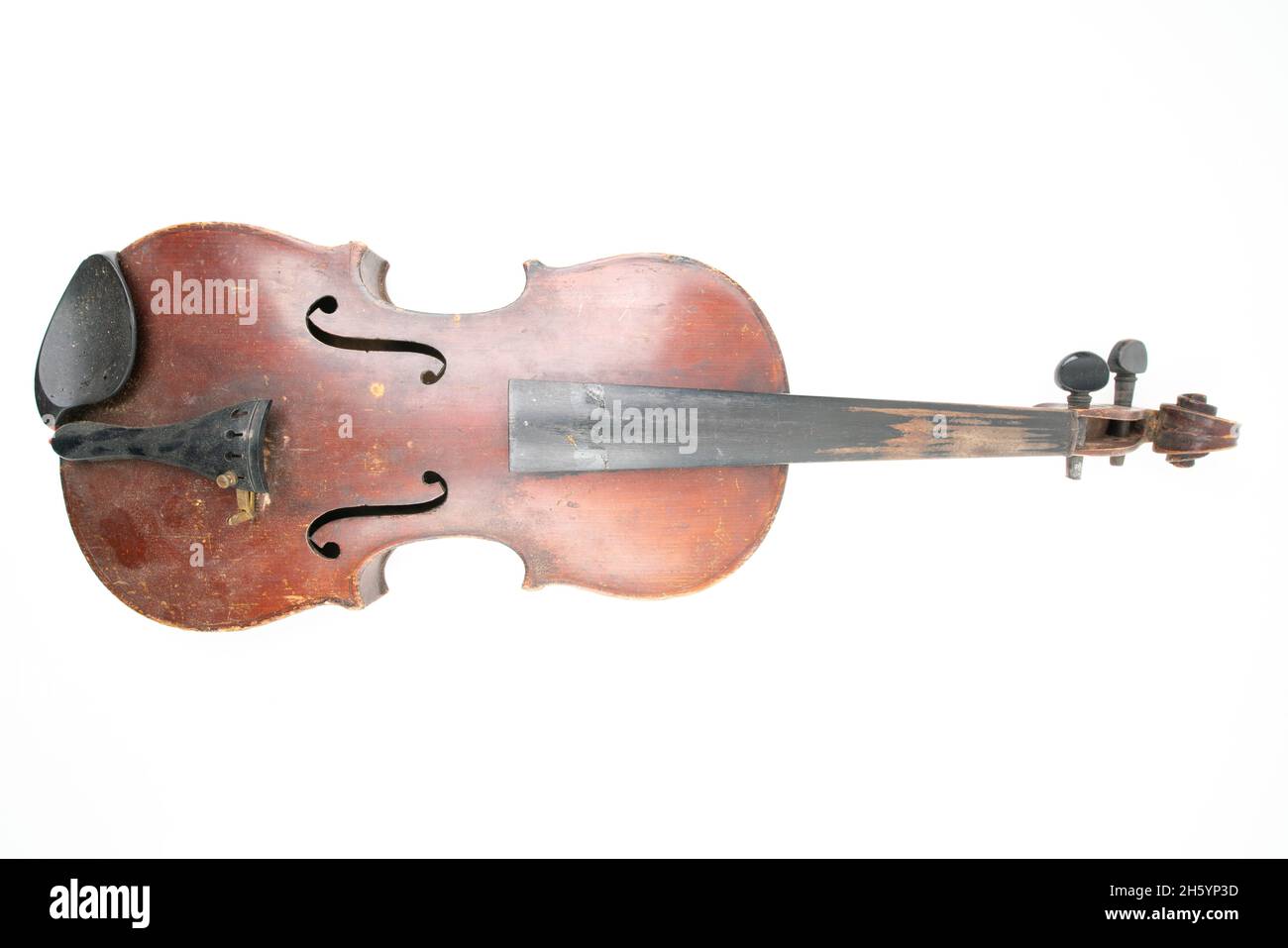 Wide closeup studio shot of old, broken, dust covered violin isolated ...