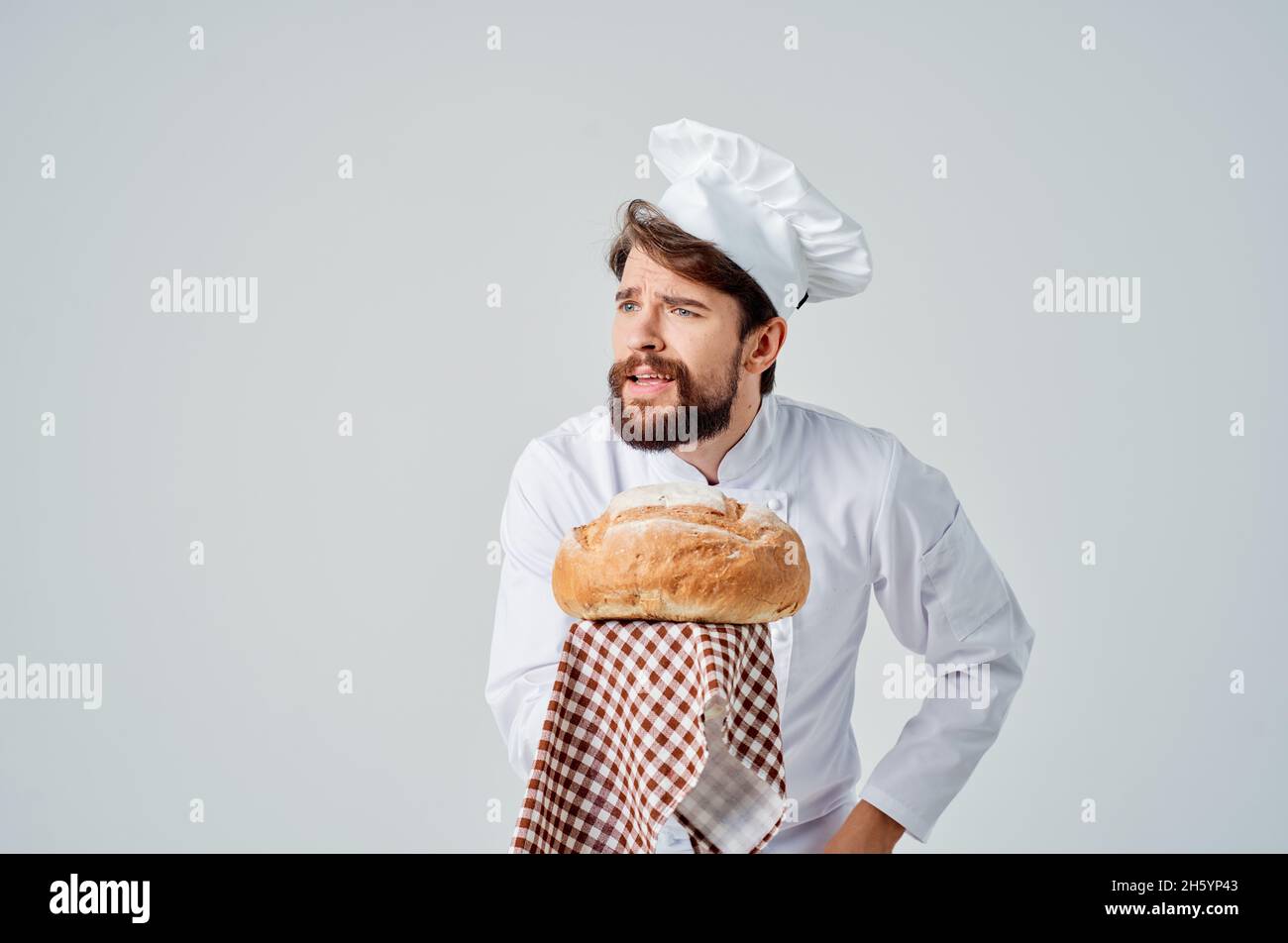 bearded man chef with bread in hand Professional emotions Stock Photo ...