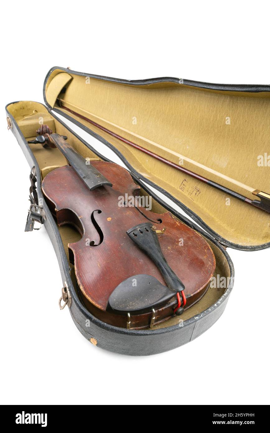 Wide closeup vertical studio shot of old, broken, dust covered violin ...