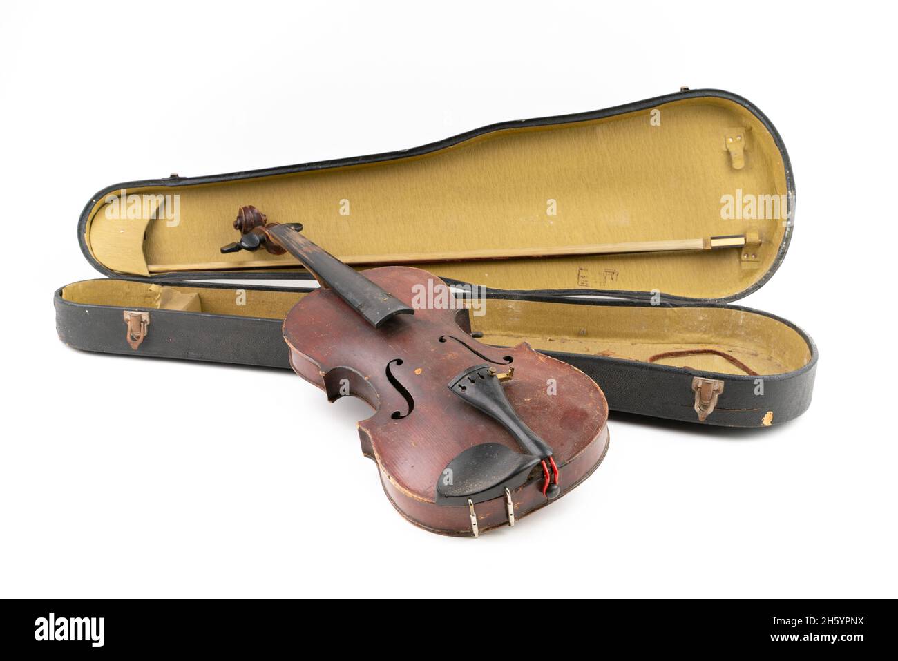 Wide closeup studio shot of old, broken, dust covered violin with its ...