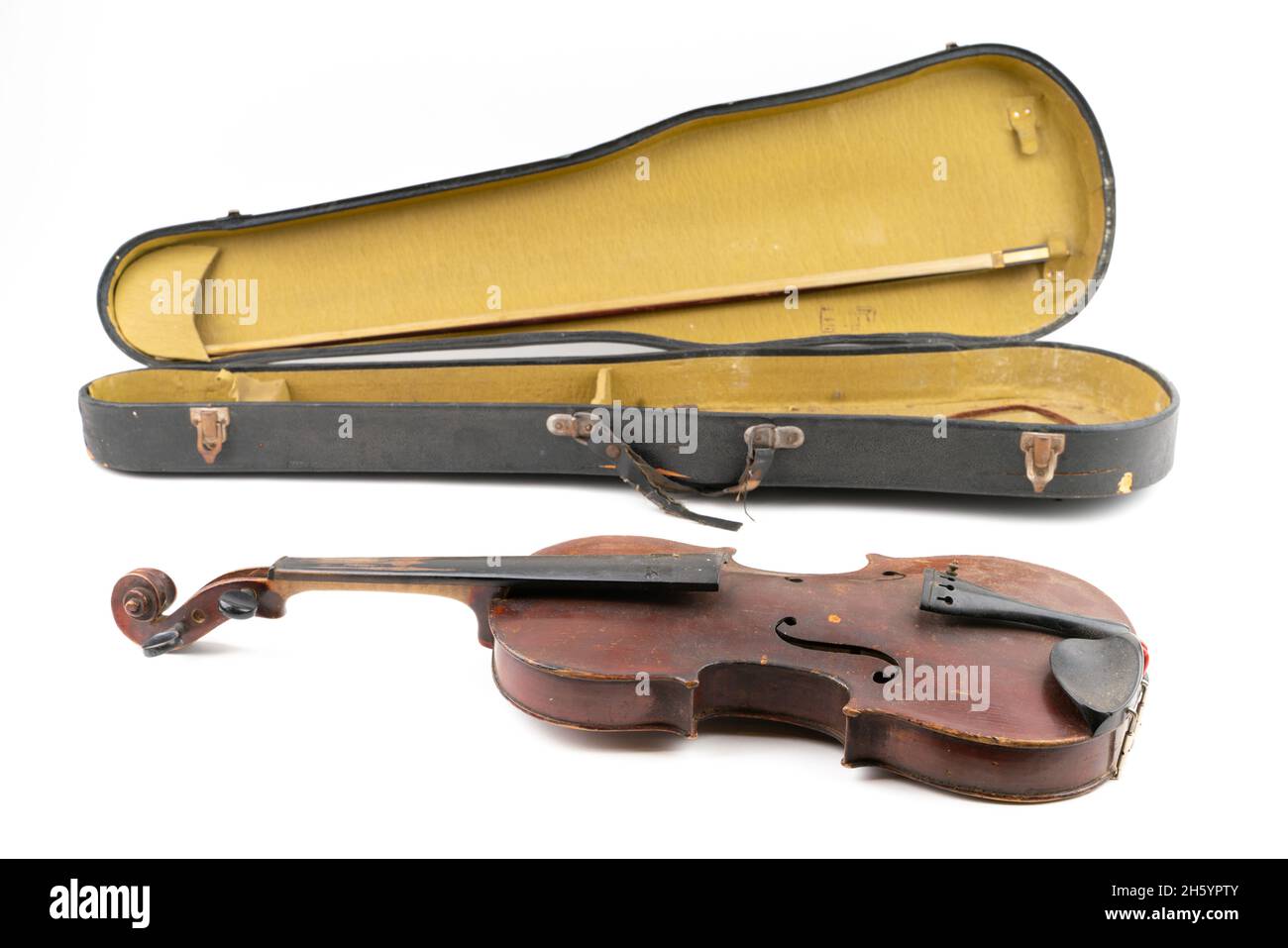 Wide closeup studio shot of old, broken, dust covered violin with its ...