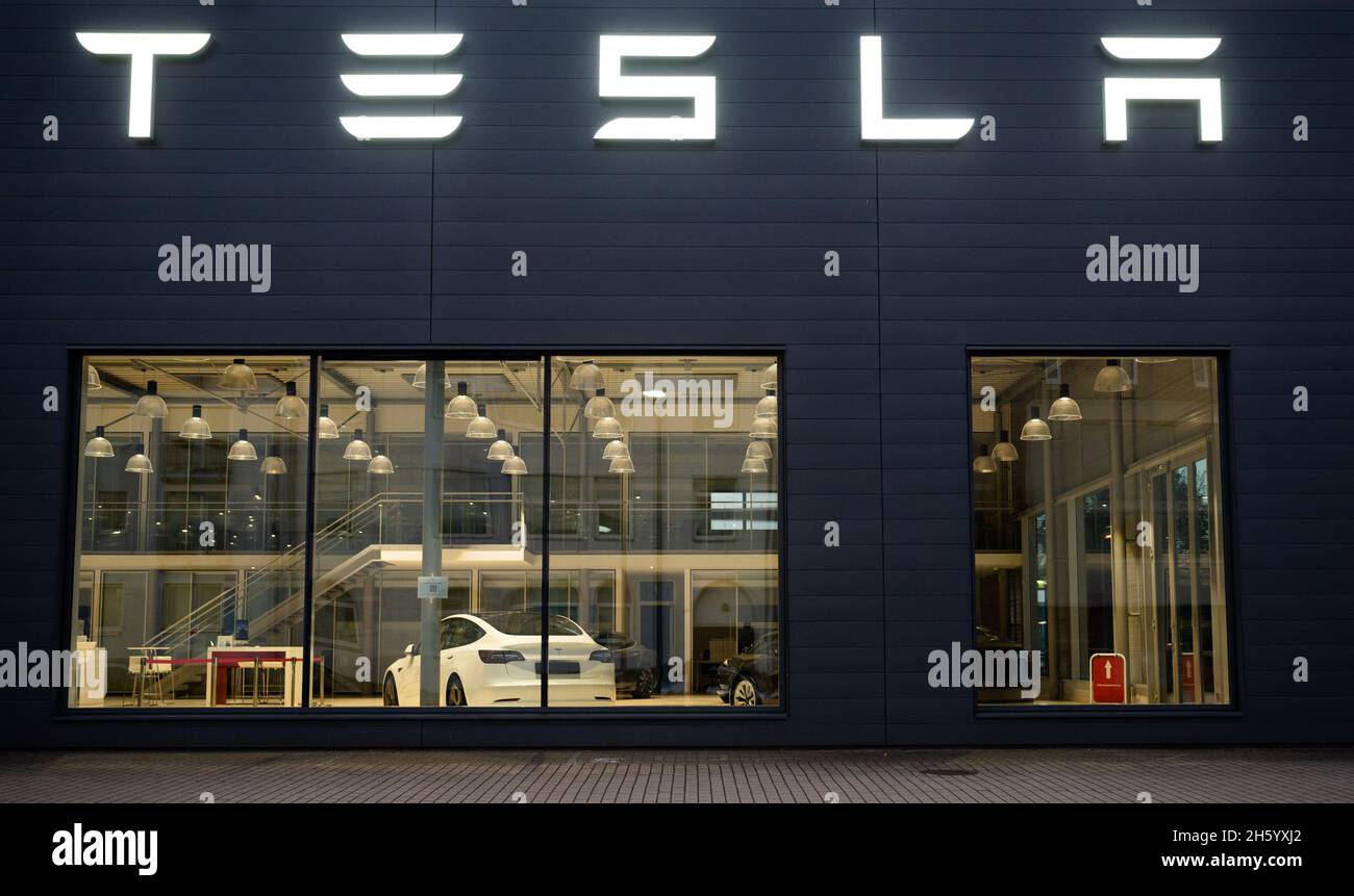 Hanover, Germany. 12th Nov, 2021. A sign lights up at a dealership of ...