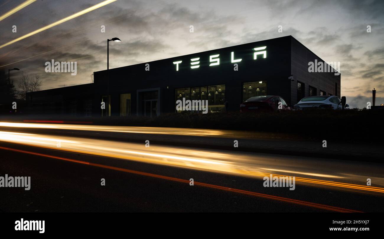 Hanover, Germany. 12th Nov, 2021. Cars drive past a dealership of the ...