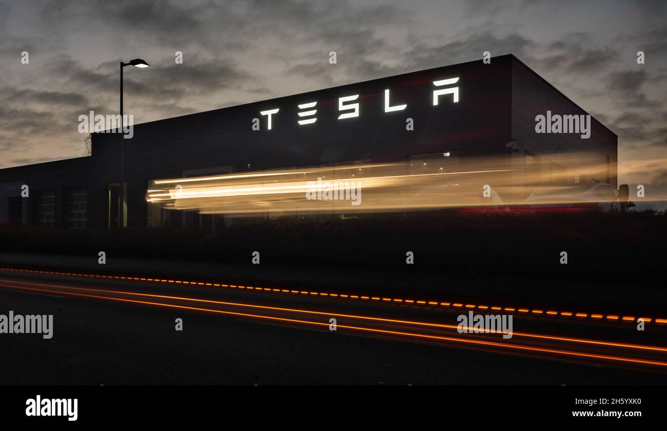 Hanover, Germany. 12th Nov, 2021. Cars drive past a dealership of the ...