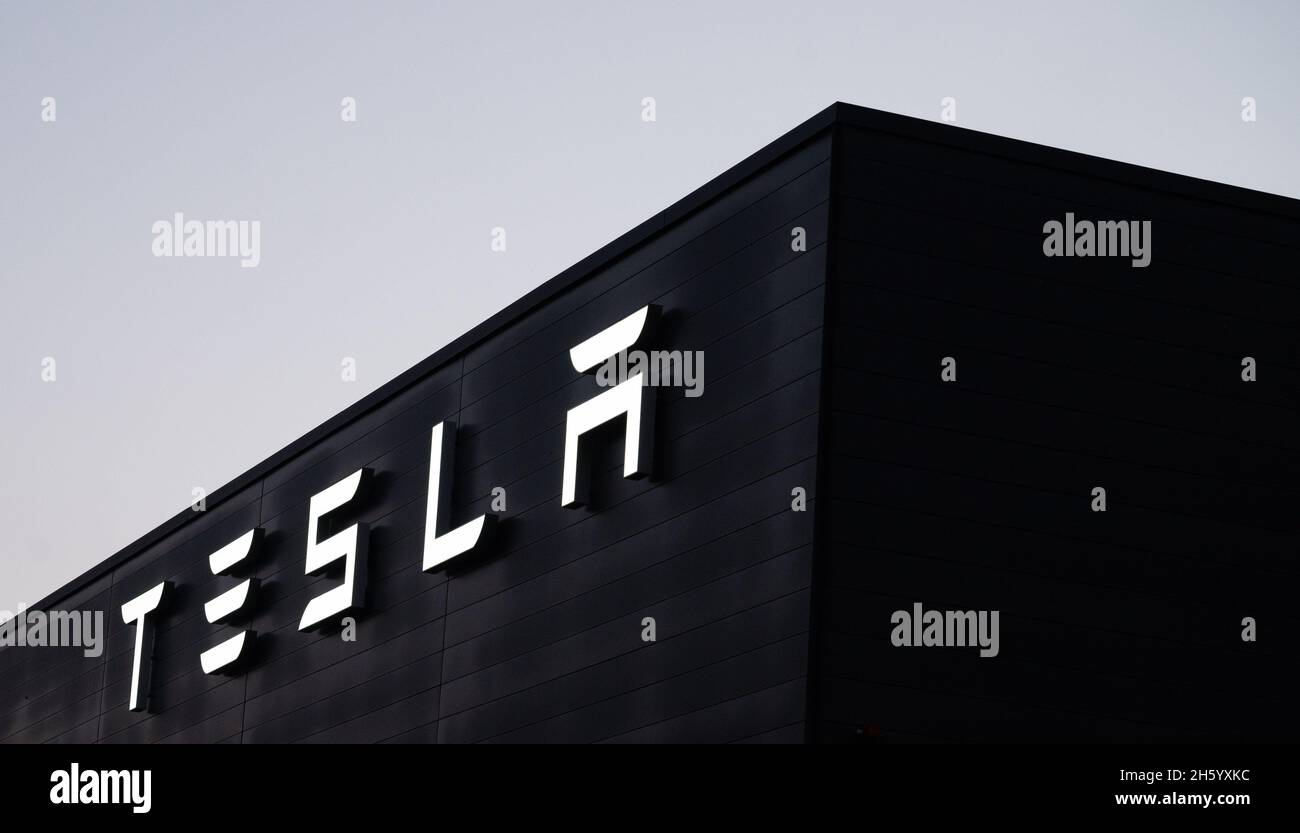 Hanover, Germany. 12th Nov, 2021. A sign lights up at a dealership of ...