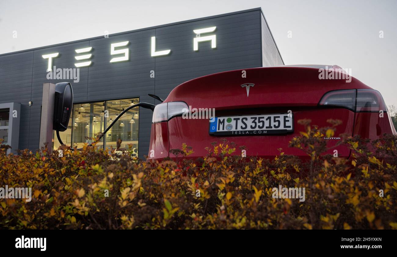 Hanover, Germany. 12th Nov, 2021. A sign lights up at a dealership of ...