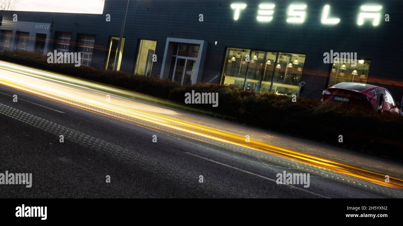 Hanover, Germany. 12th Nov, 2021. Cars drive past a dealership of the ...