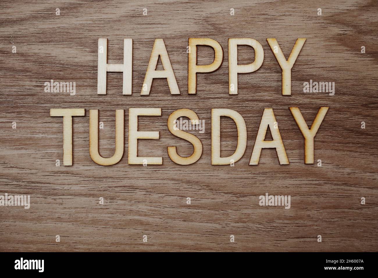 Happy Tuesday text message on wooden background Stock Photo - Alamy