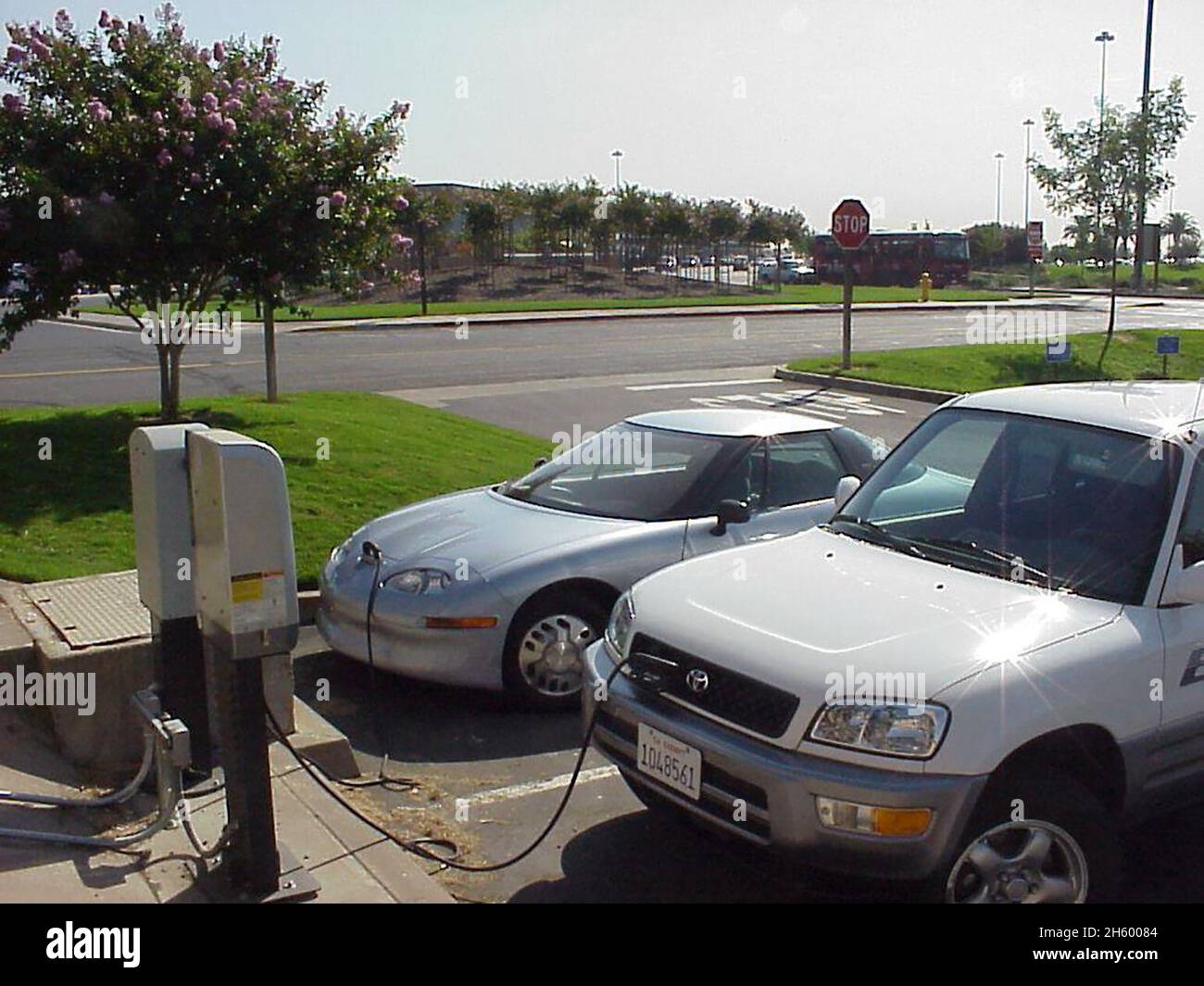 Electric vehicles being charged at an EV charger ca. 2009 Stock Photo ...