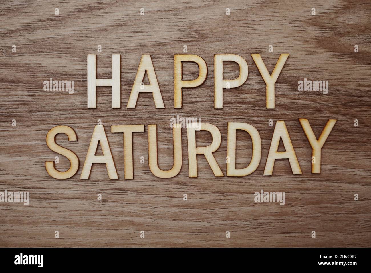 Happy Saturday text message on wooden background Stock Photo - Alamy