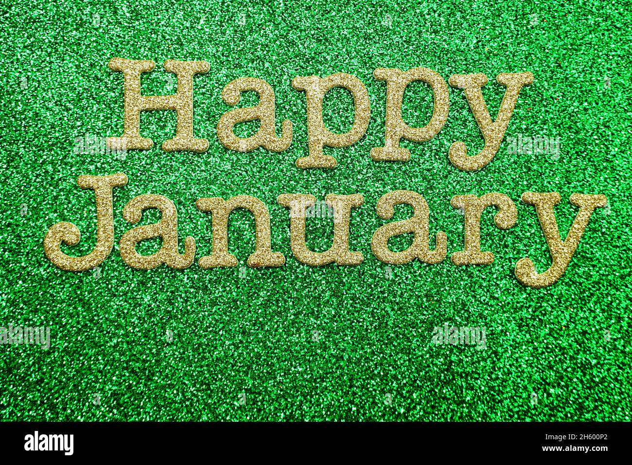 Hello January alphabet letters on green glitter background Stock Photo ...