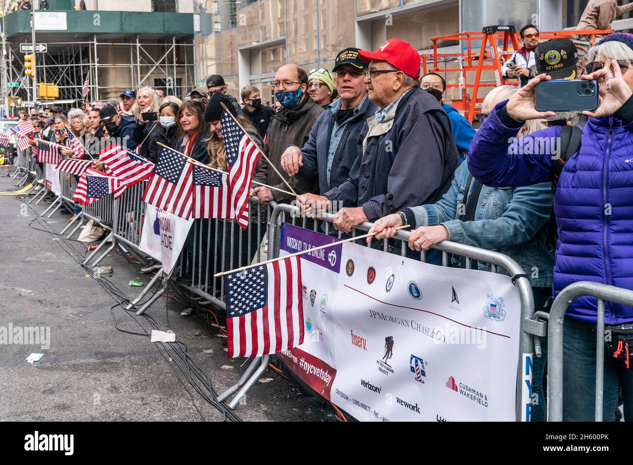 New York, NY - November 11, 2021: People lined up along Fifth Avenue to ...