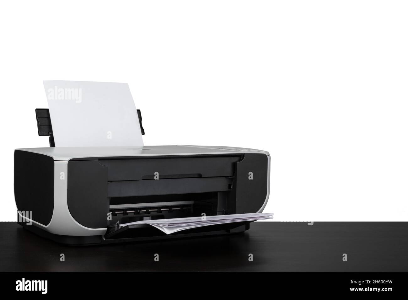 Laser home printer on table against white backgorund Stock Photo - Alamy