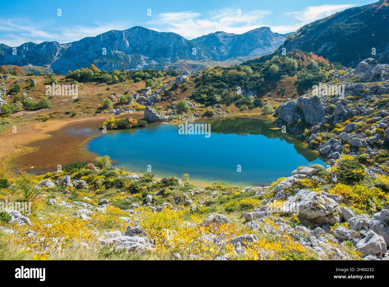 Small natural lake in the mountains Stock Photo - Alamy