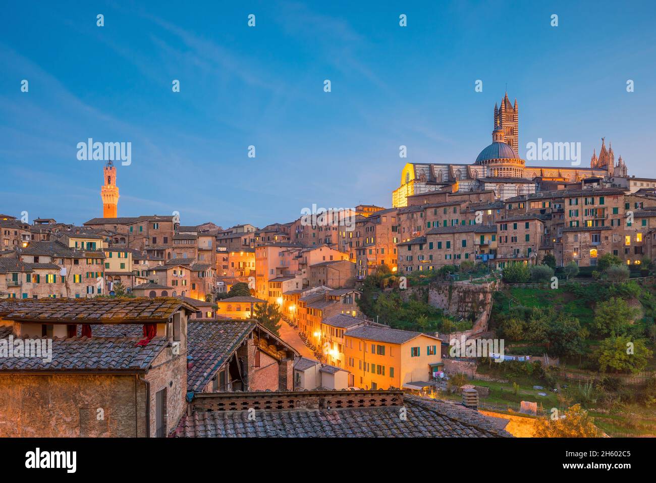 Downtown Siena skyline in Italy at twilight Stock Photo - Alamy