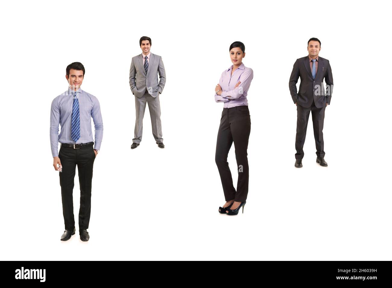 A Team of corporate employees standing at a social distance in formal ...