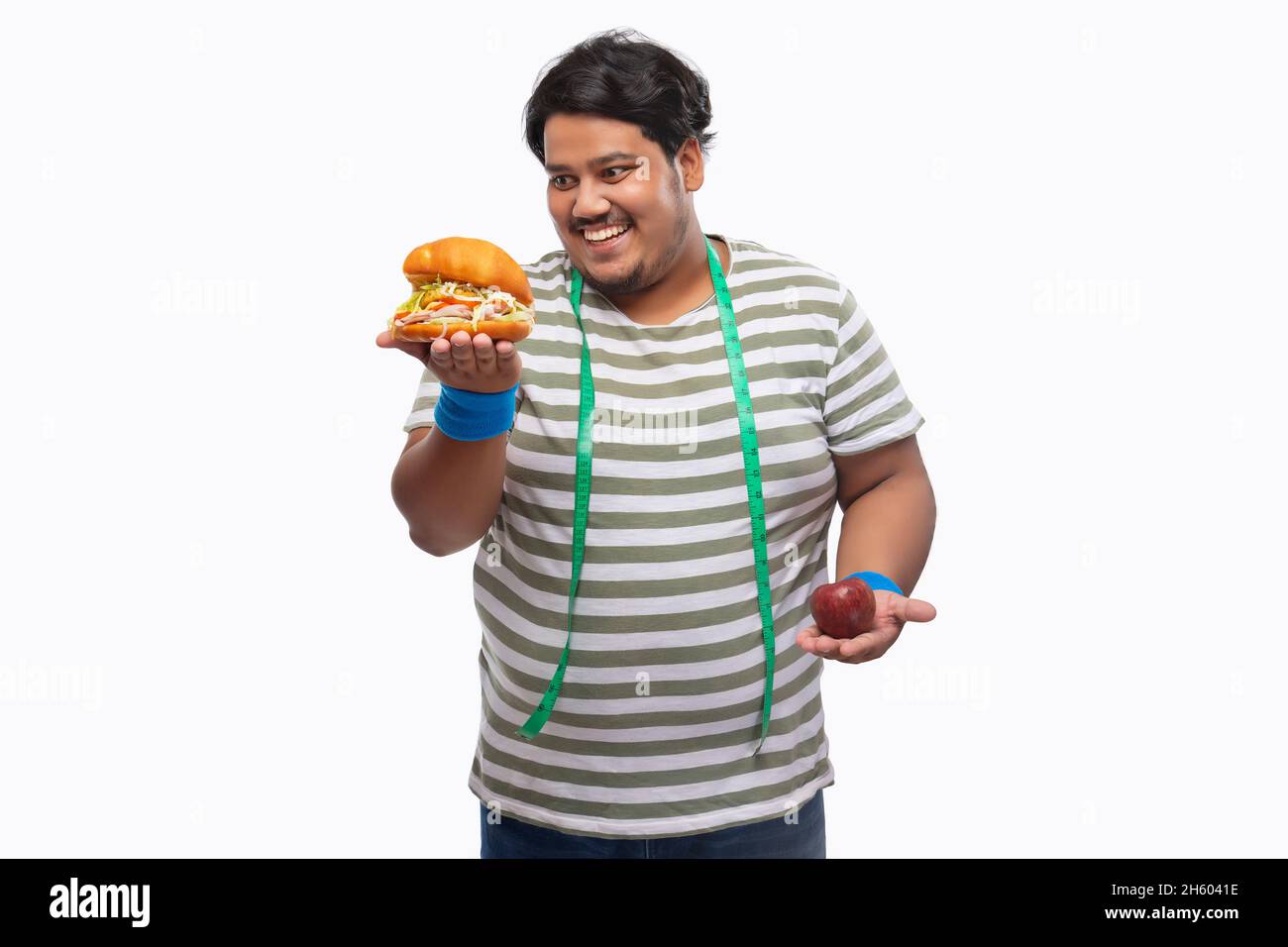 Fat man measuring belly hi-res stock photography and images - Alamy
